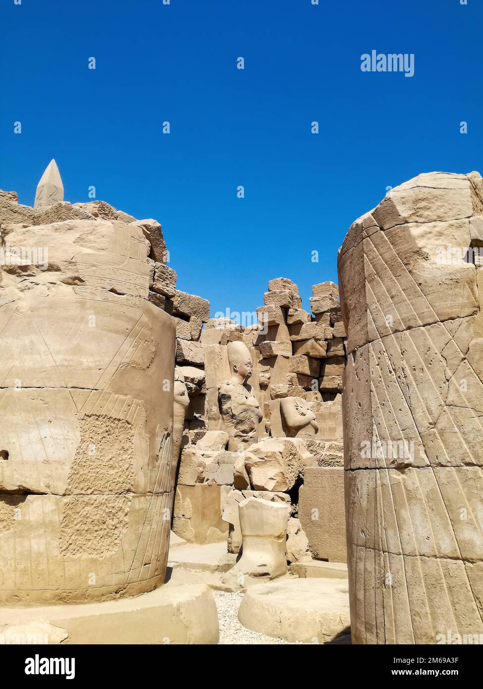 Ruins of Karnak Temple complex with statues, pylons, sculptures and ...