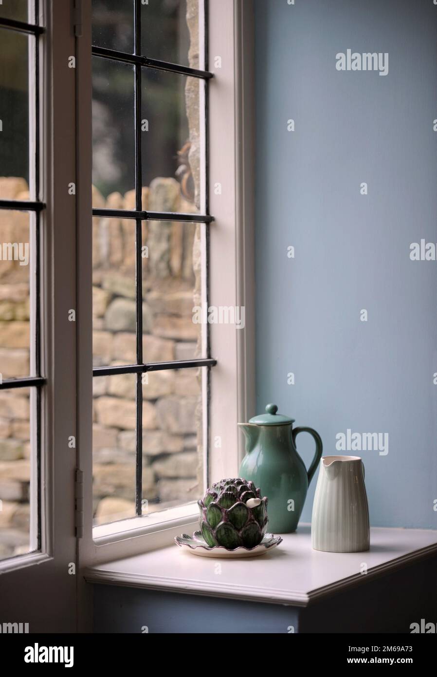 Pottery on a window sill Stock Photo - Alamy