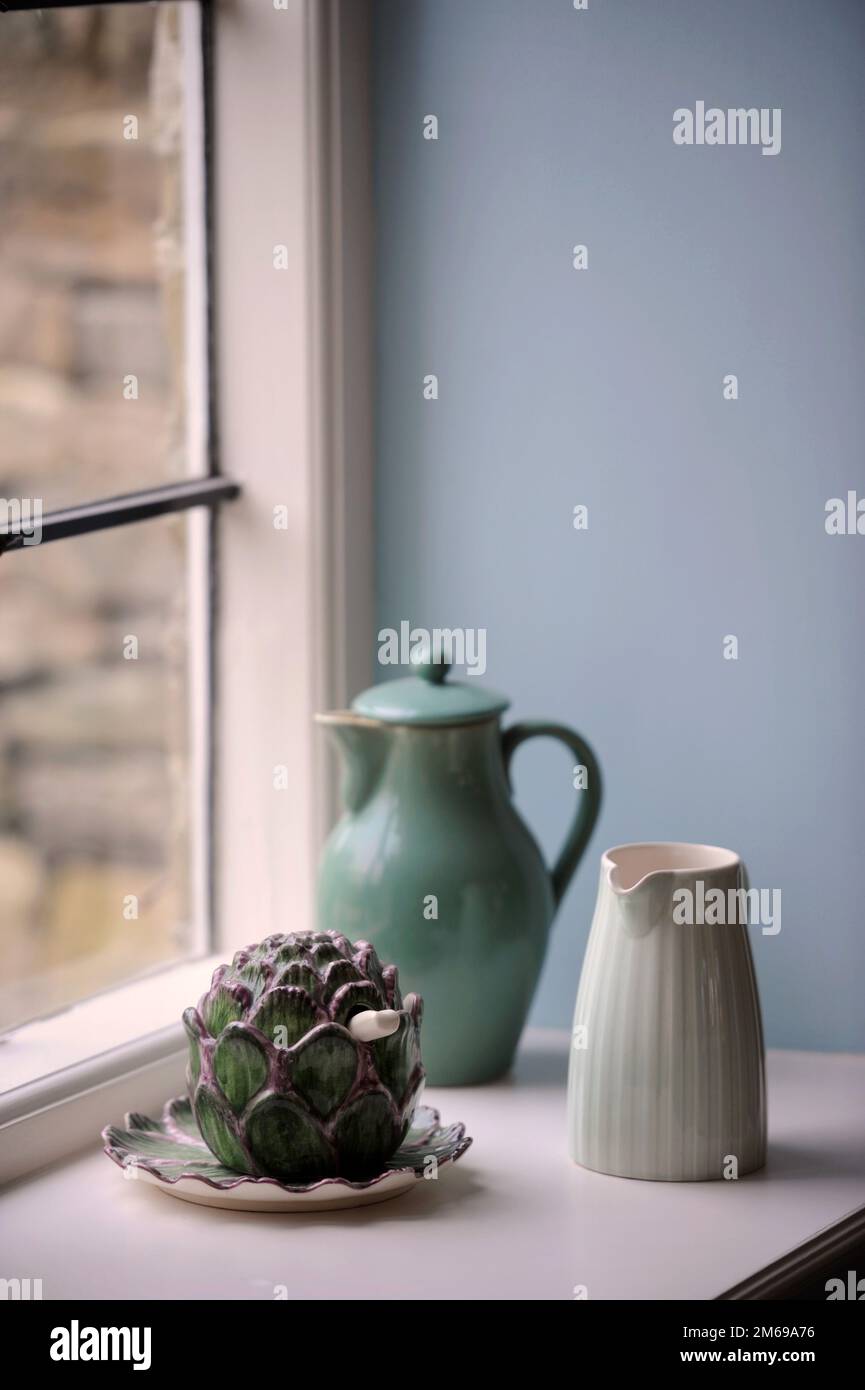 Pottery on a window sill Stock Photo - Alamy