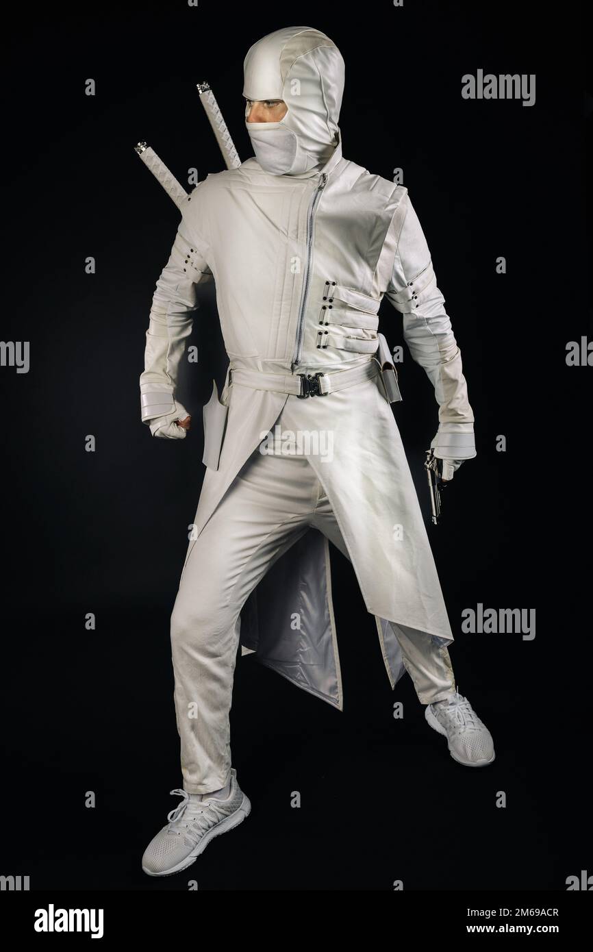 Ninja posing for a photo on a black background, a male ninja in a white ...