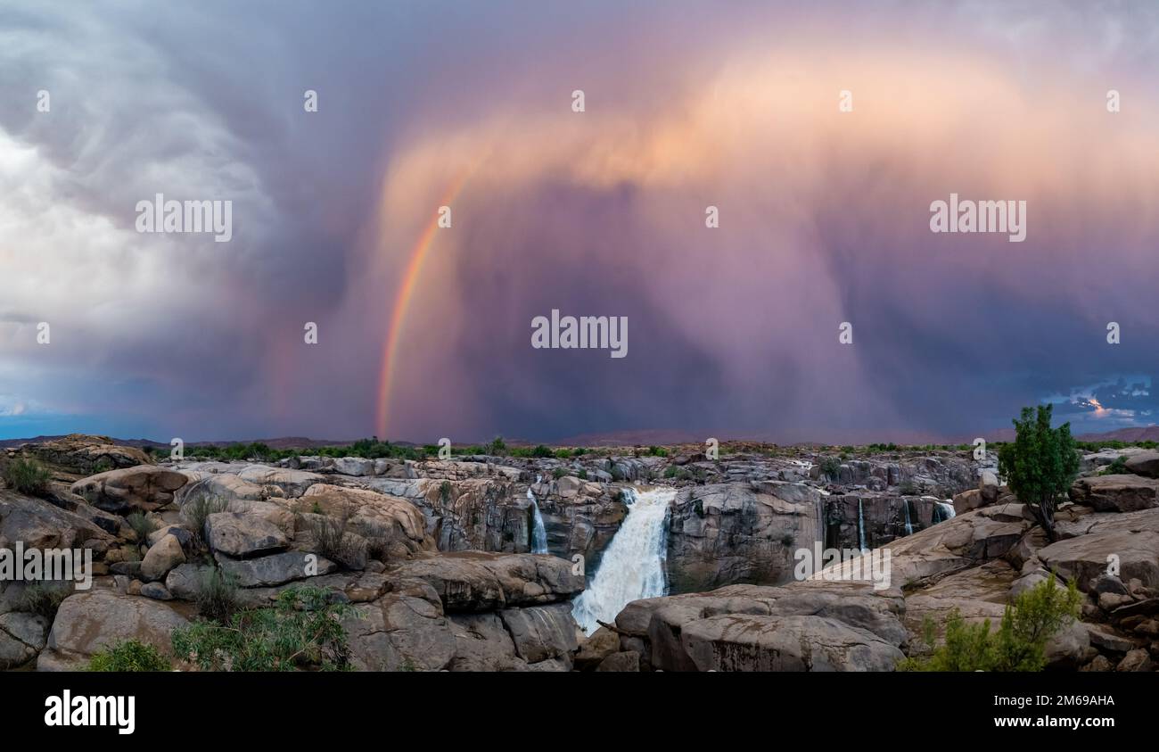 Rainbow and storm clouds over Augrabies Falls. Augrabies Falls National ...