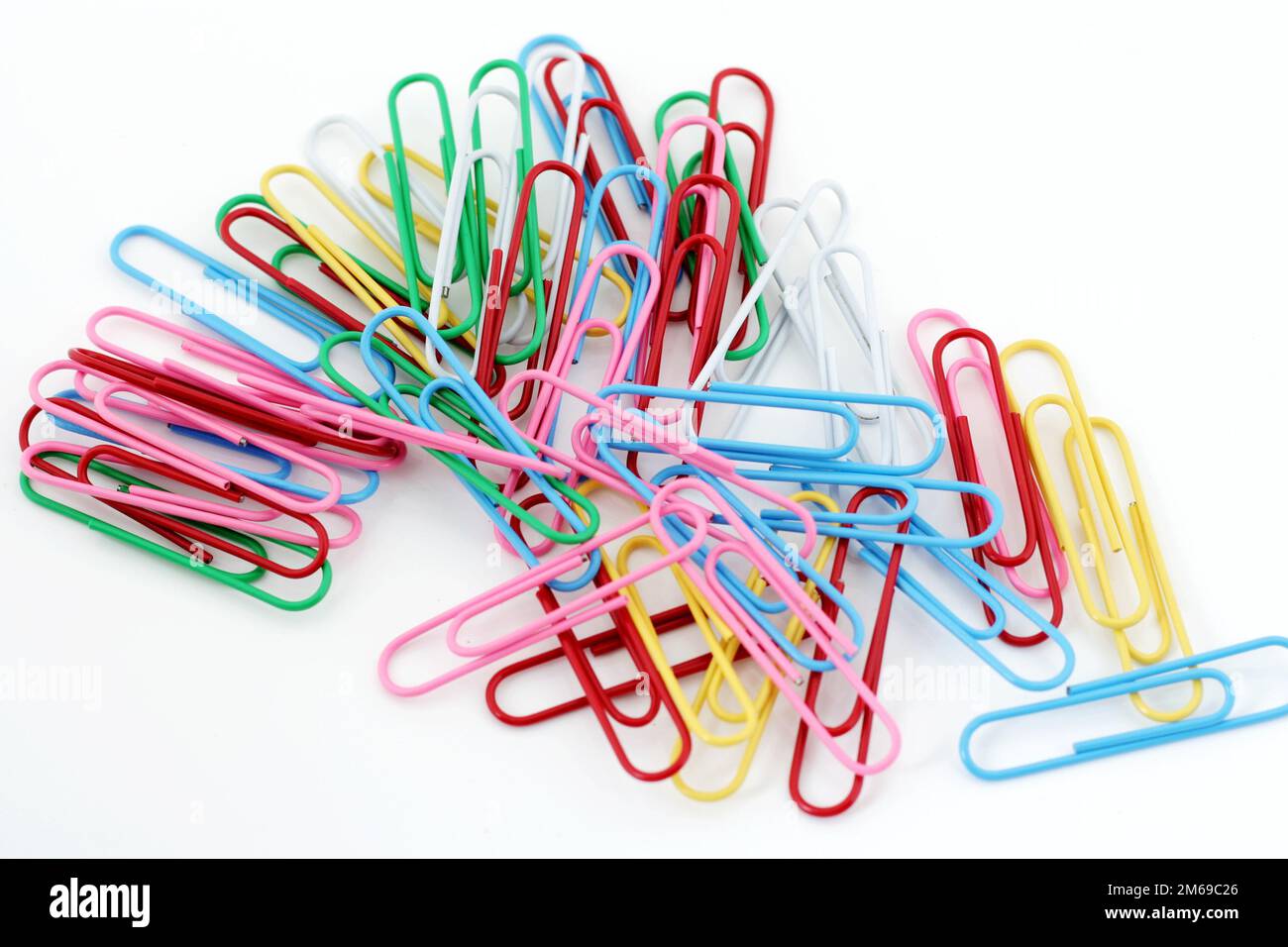 Colored paperclips isolated on white background Stock Photo - Alamy