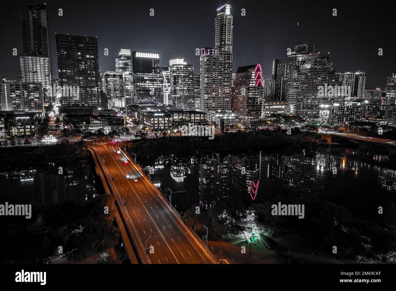 A cityscape of illuminated streets and buildings of Austin at night in ...
