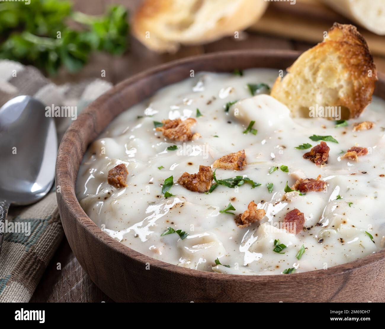 New england clam chowder with bacon, parsley and toasted french bread ...