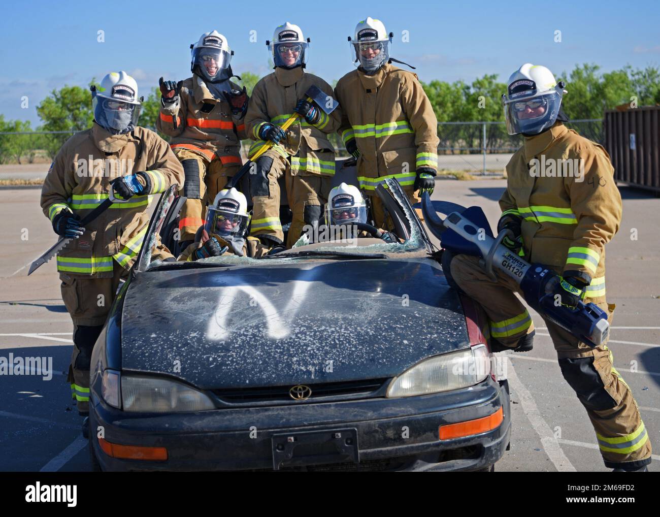 Fire marshals pose after completing a vehicle extraction exercise at ...
