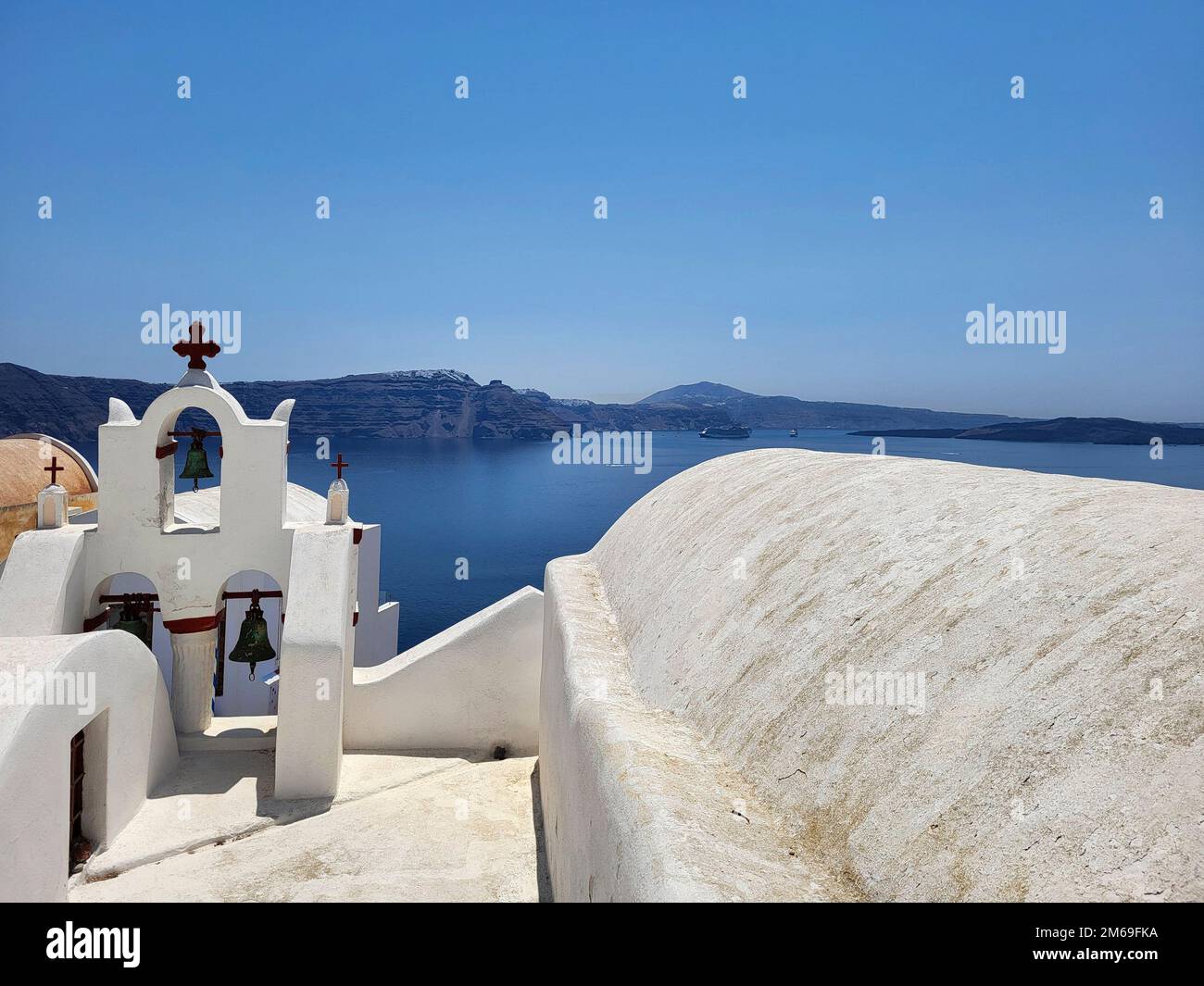 Greece, clock tower in the town of Oia on Santorini Island Stock Photo ...
