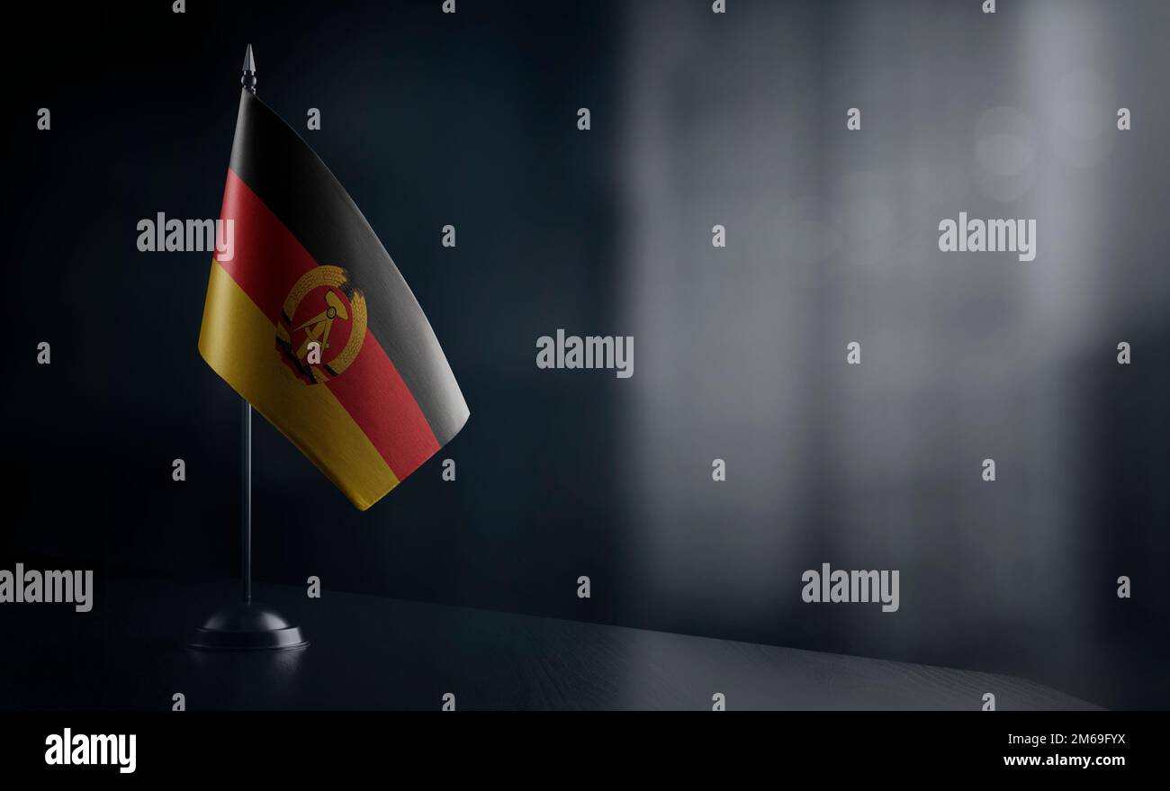 Small national flag of the GDR on a black background Stock Photo - Alamy
