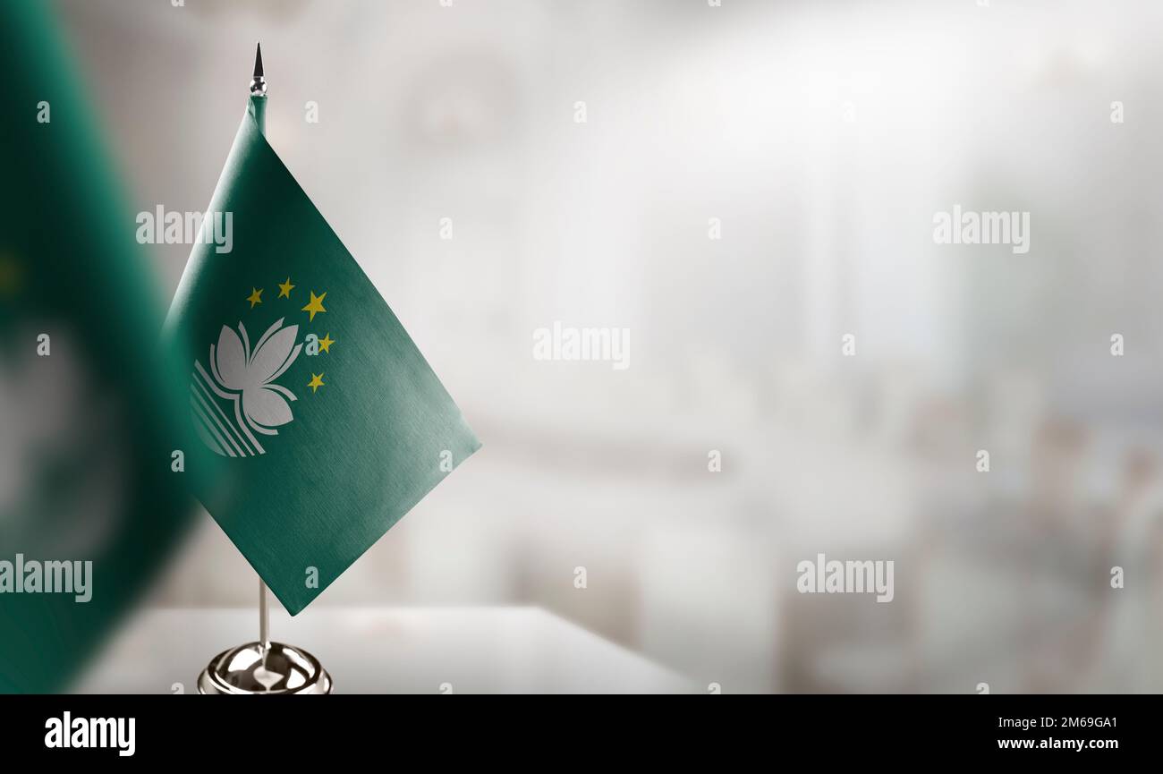 Small flags of the Macao on an abstract blurry background Stock Photo ...