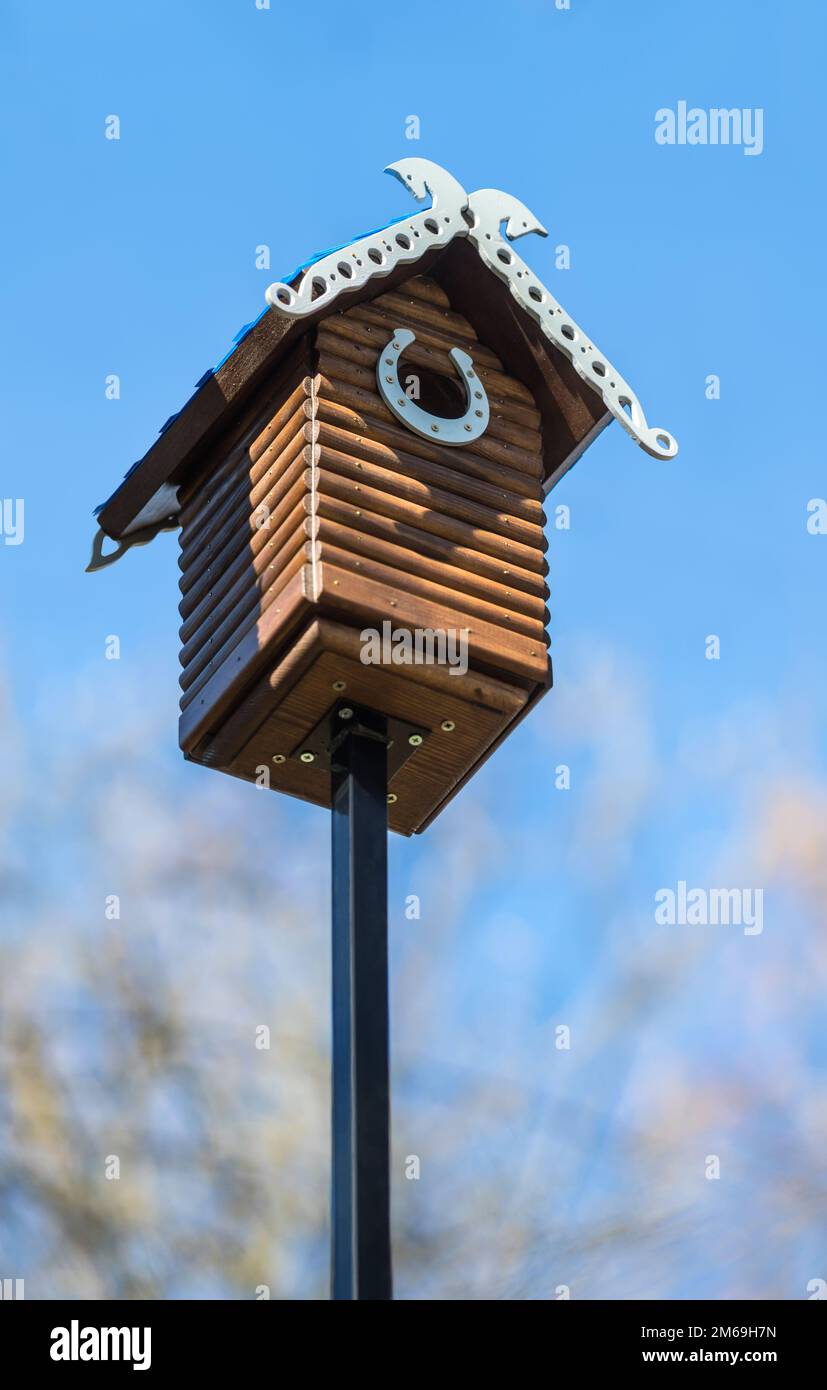 Nesting box. Carved wooden nest box handmade. Wooden house for birds on ...