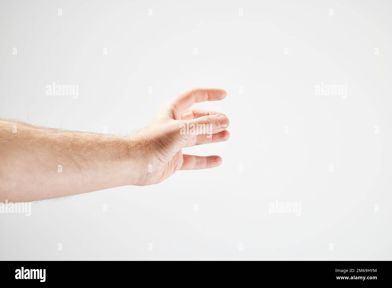 Male hand in front of white background Stock Photo - Alamy