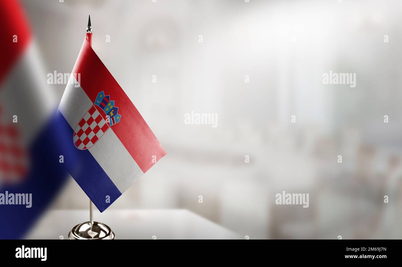 Small flags of the Croatia on an abstract blurry background Stock Photo ...