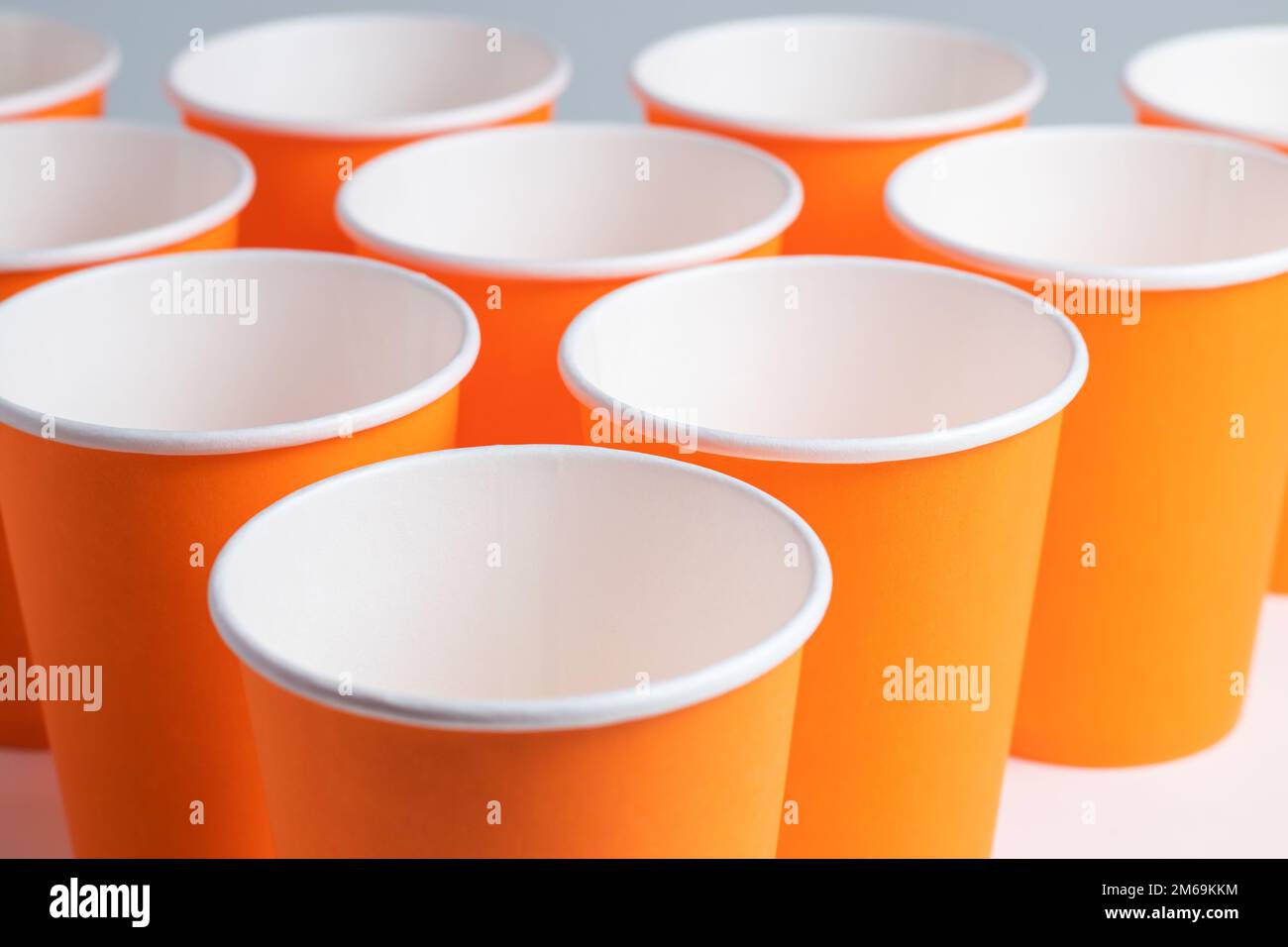 large group of orange disposable paper cups Stock Photo - Alamy