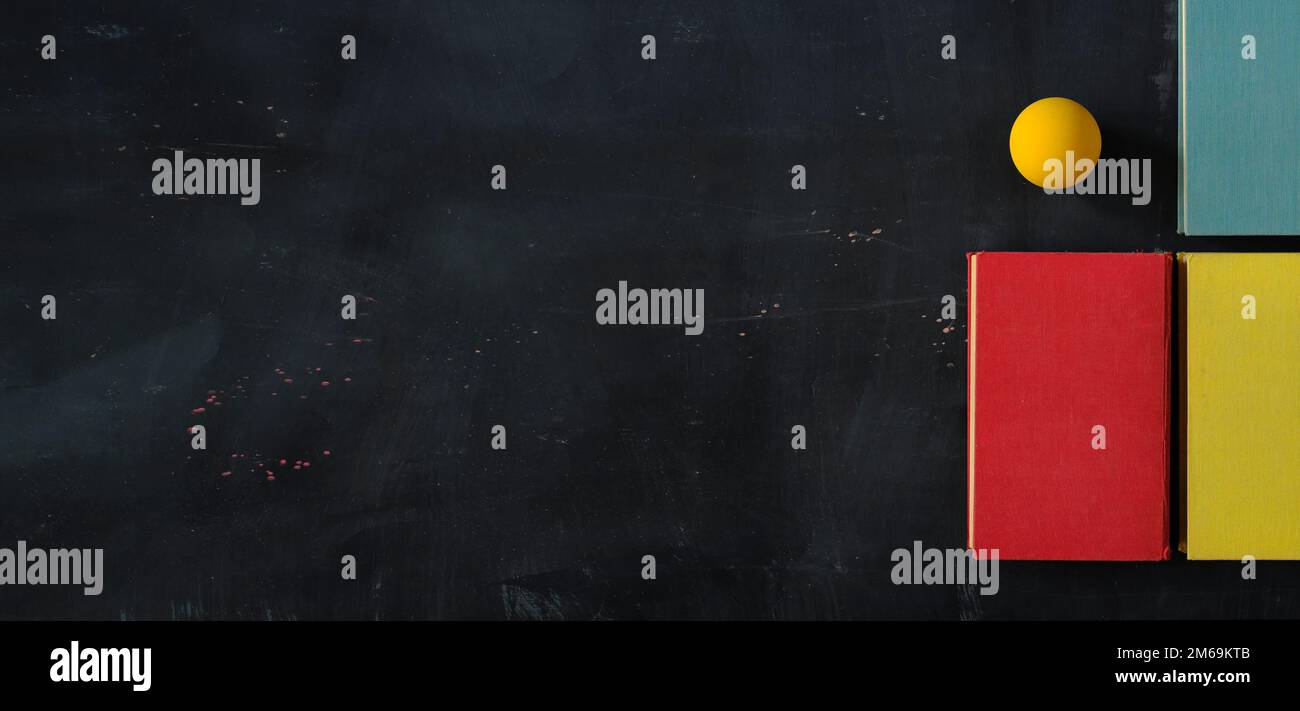 books and yellow ball, modern art inspired flat lay, education,reading ...