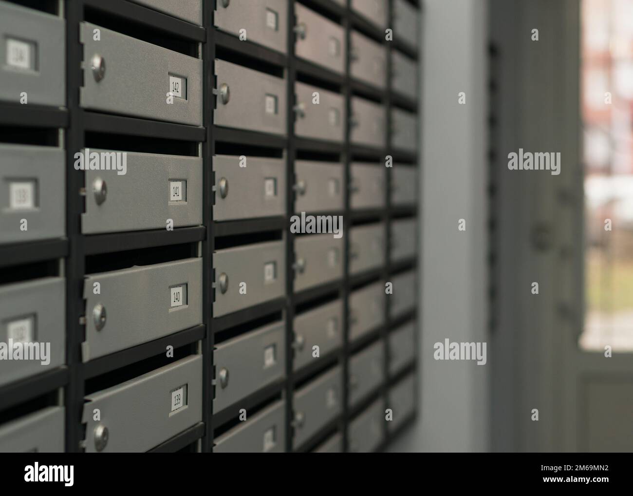 Mailboxes filled with numbers. In an apartment building 2 Stock Photo ...