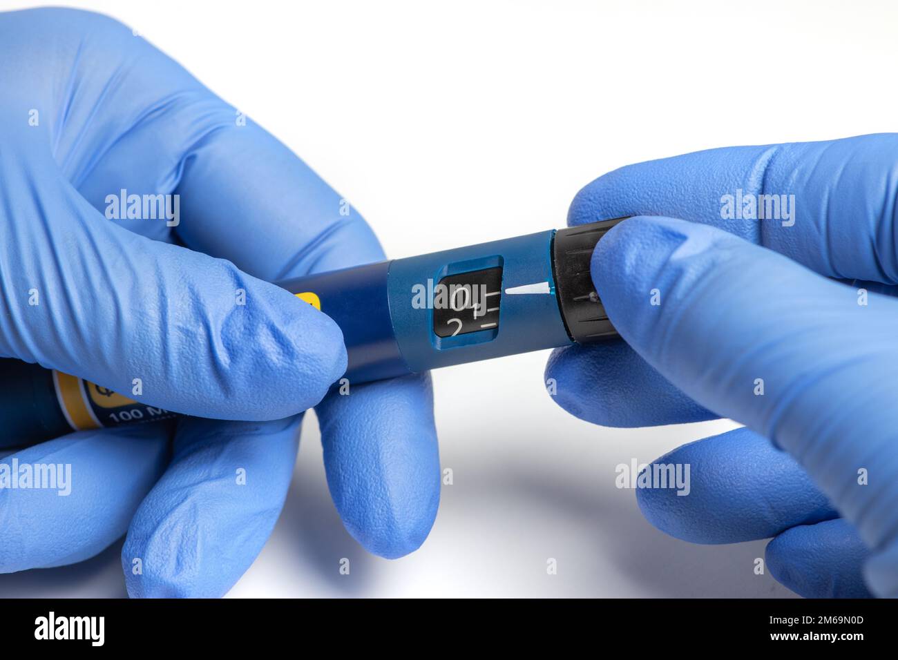 Scale on the bottom of insulin pen in hand of the doctor, self ...