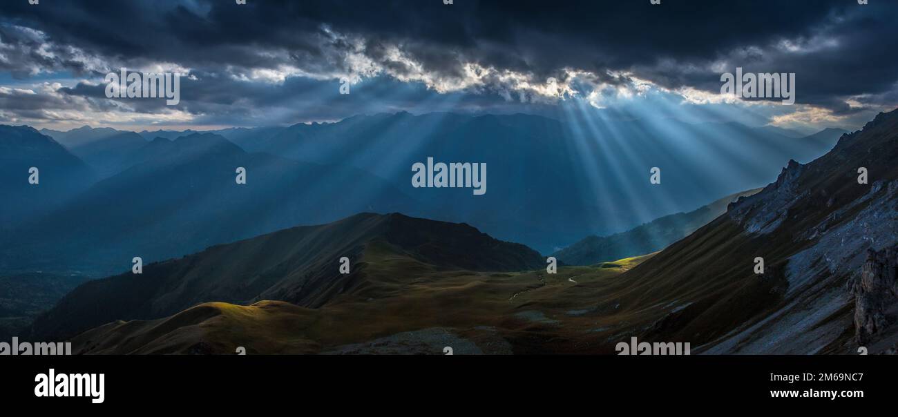 Mountain valley in beams of evening sun. View of Northwest spurs ...