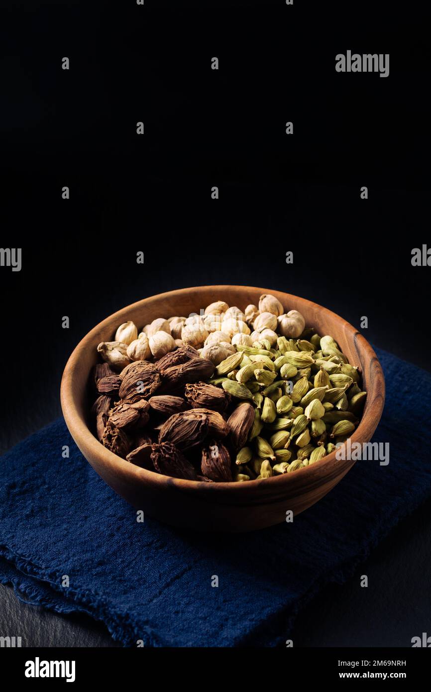 Food Spices concept 3 colors of cardamom pods green, black, white ...