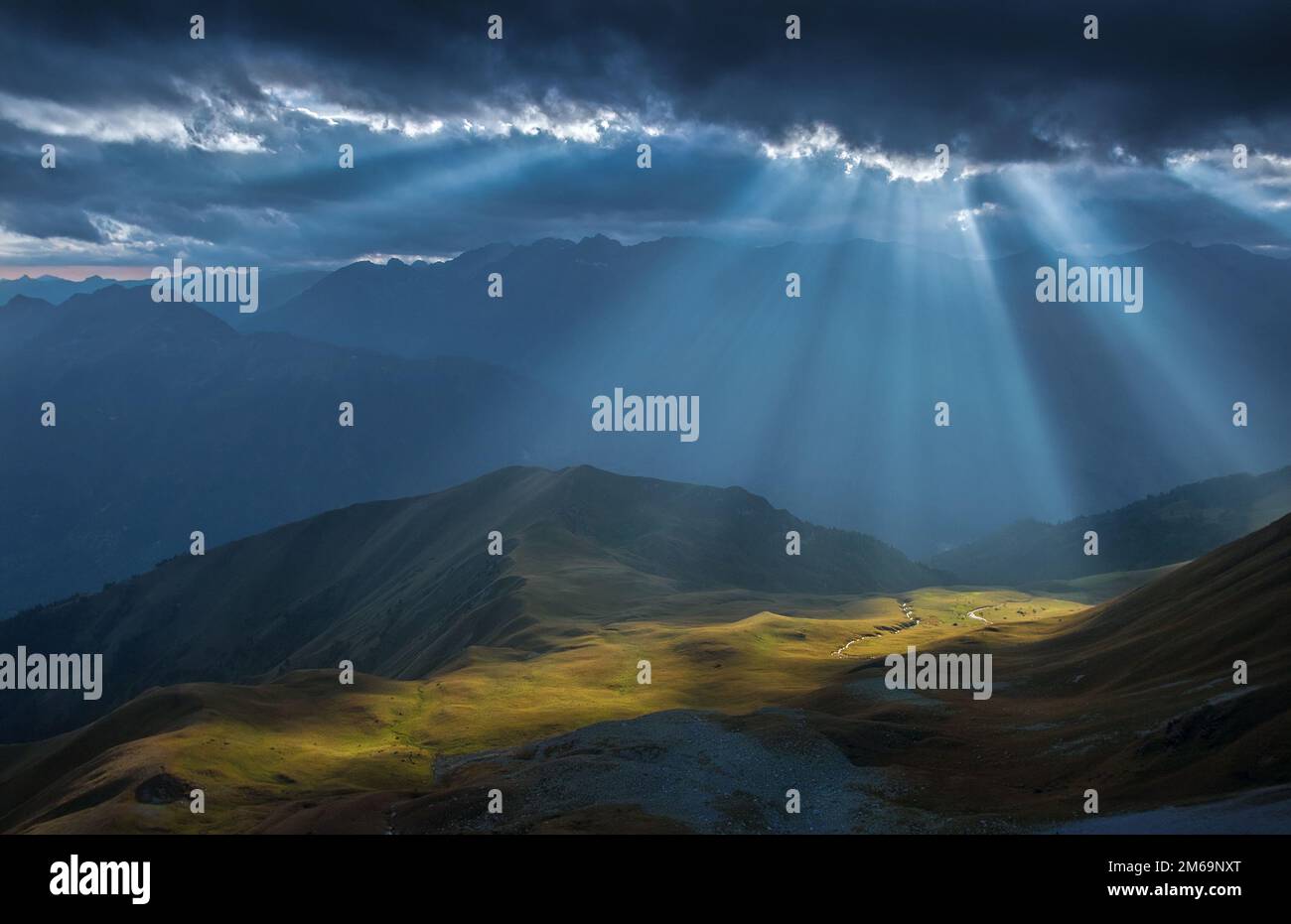 Mountain valley in beams of evening sun. View of Northwest spurs ...