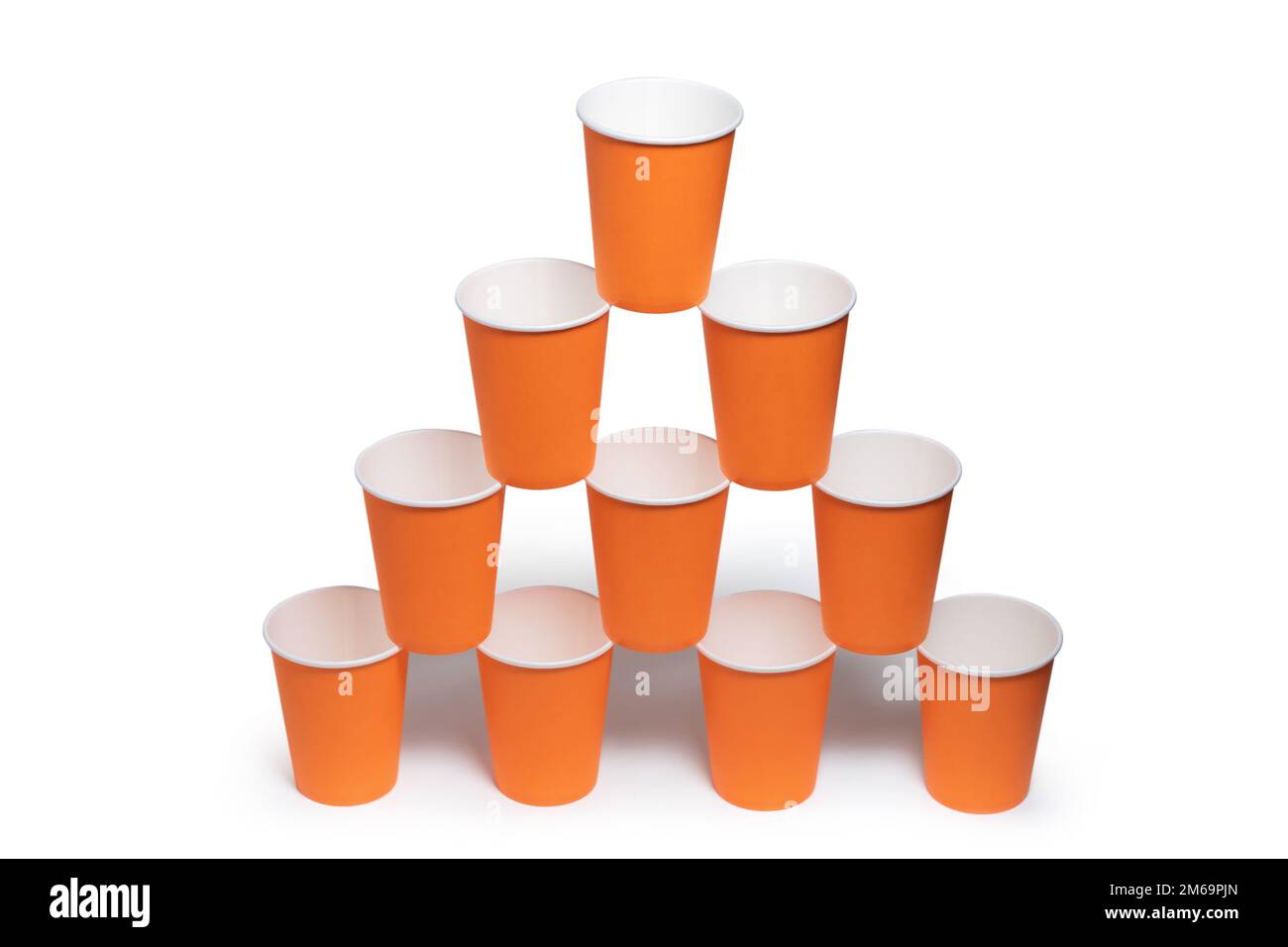 Pyramid of orange disposable paper cups isolated on white background ...
