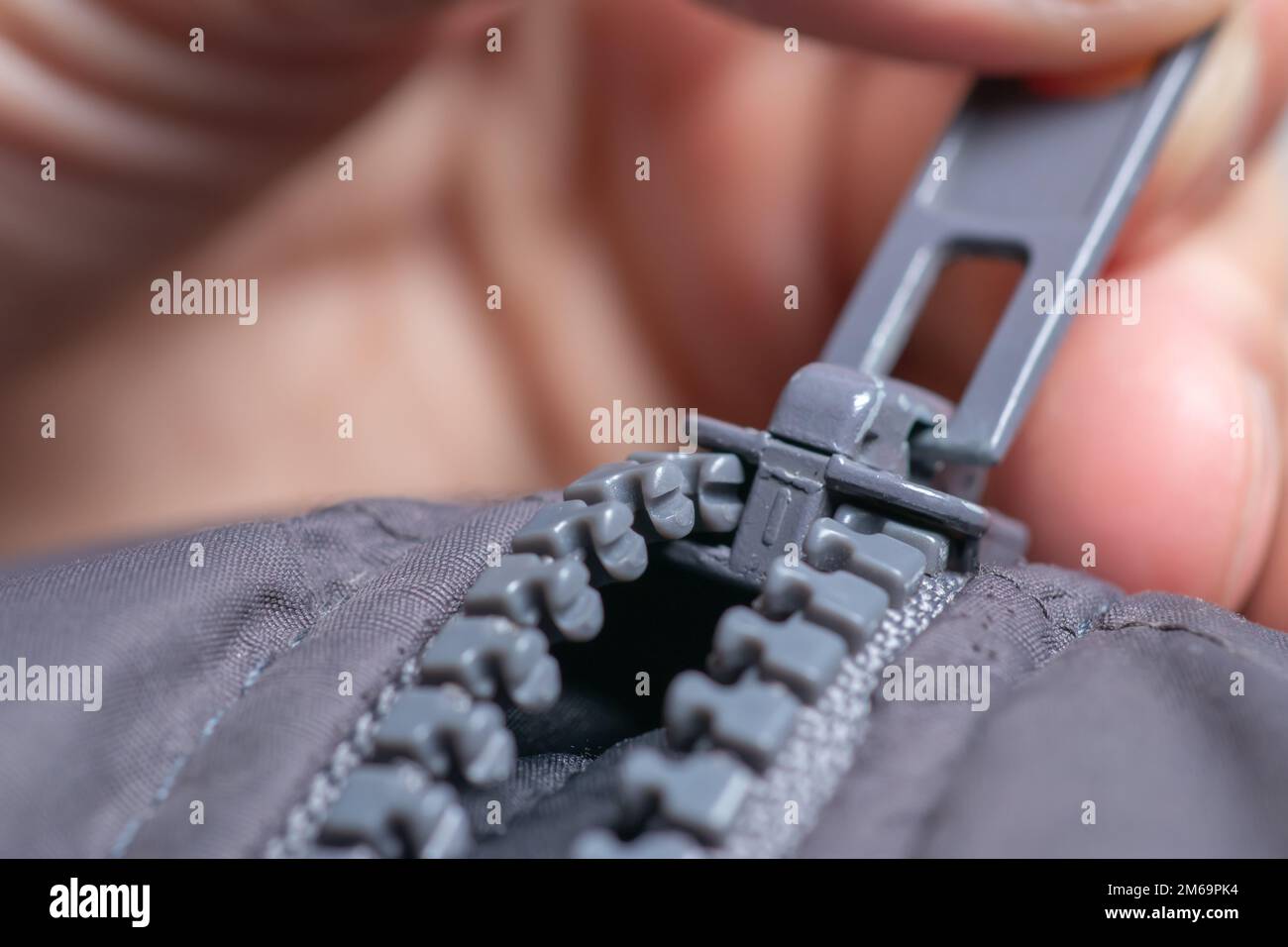 Iron zipper close up view, needlework concept Stock Photo - Alamy