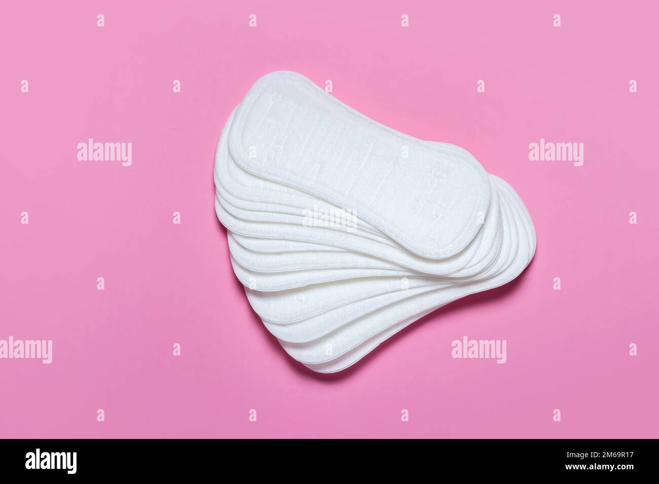 Feminine hygiene pads on a pink background. Concept of feminine hygiene ...