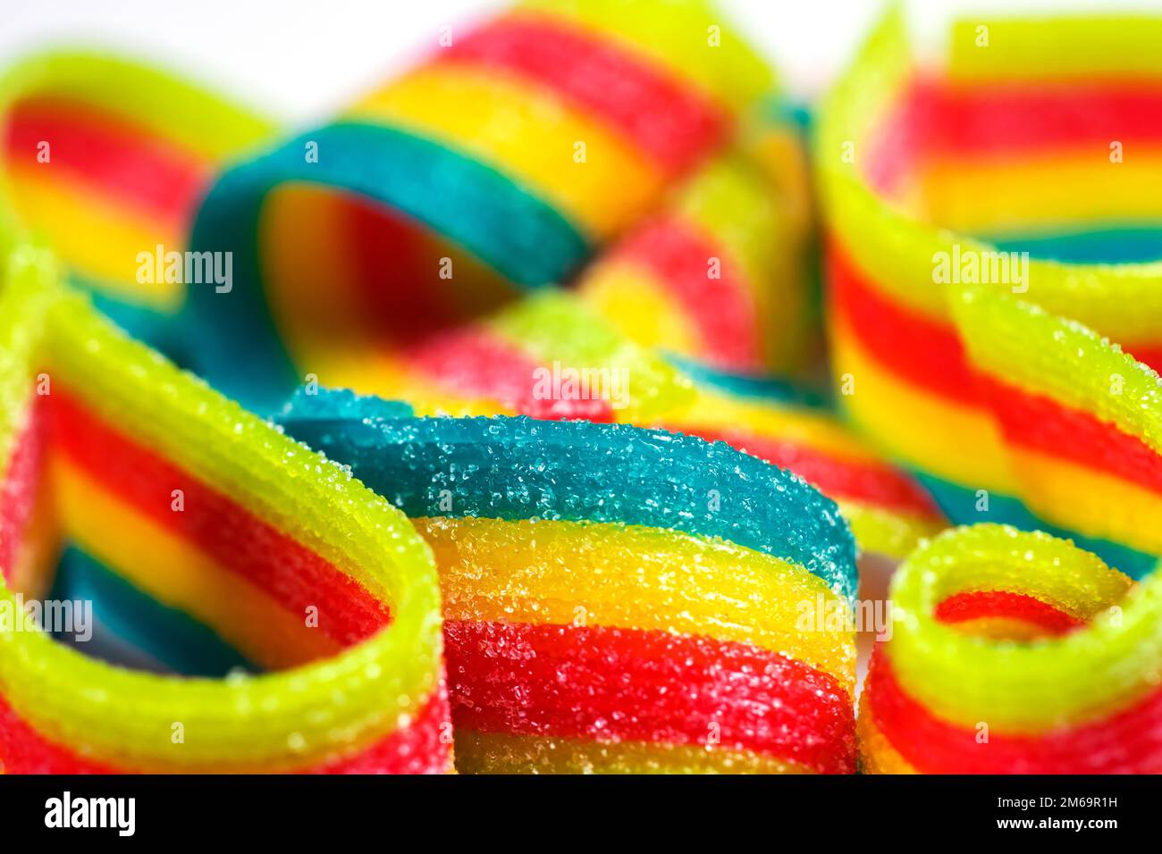 Rainbow sour jelly candies strips in sugar sprinkle Stock Photo - Alamy