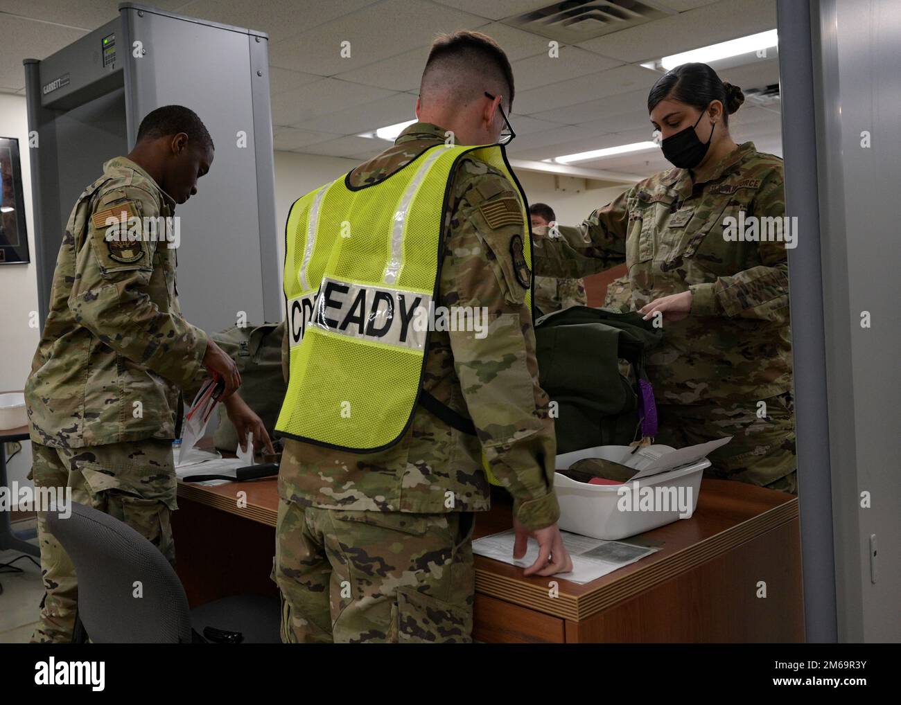 U.S. Air Force Airmen get their bags checked during a simulated TSA ...