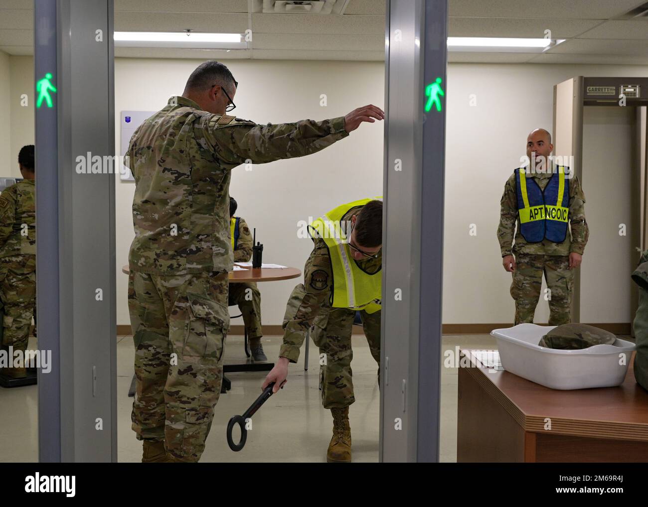 U.S. Air Force Airmen are screened at a simulated TSA security check at ...
