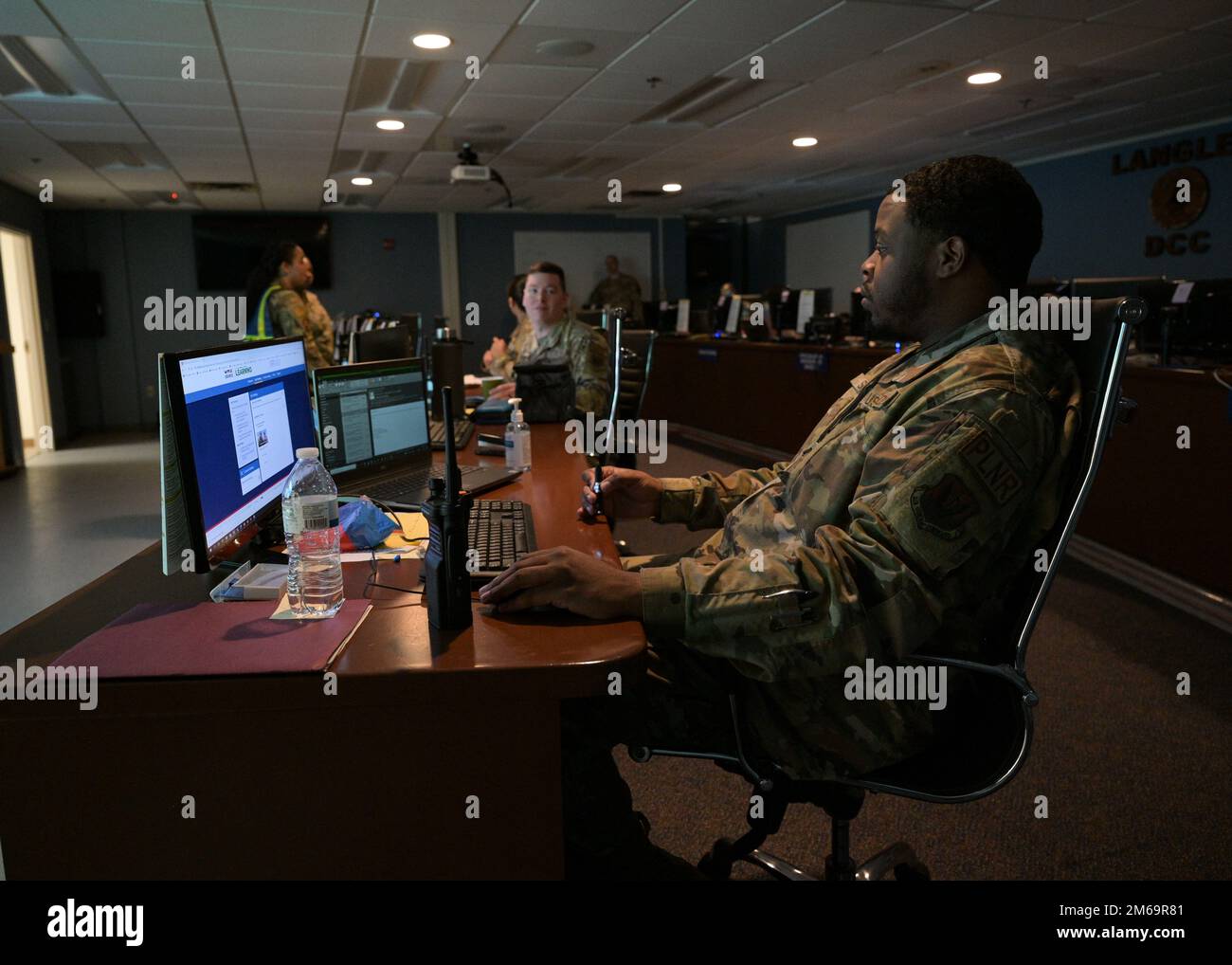 U.S. Air Force Airmen working at the Deployment Control Center oversee ...