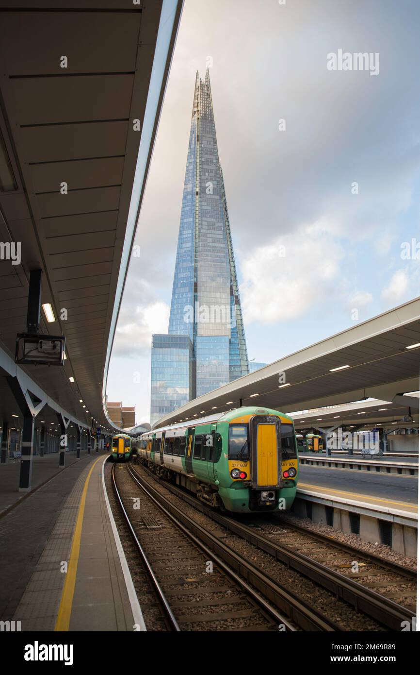 Commuter train at London Bridge Station National Rail and The Shard ...