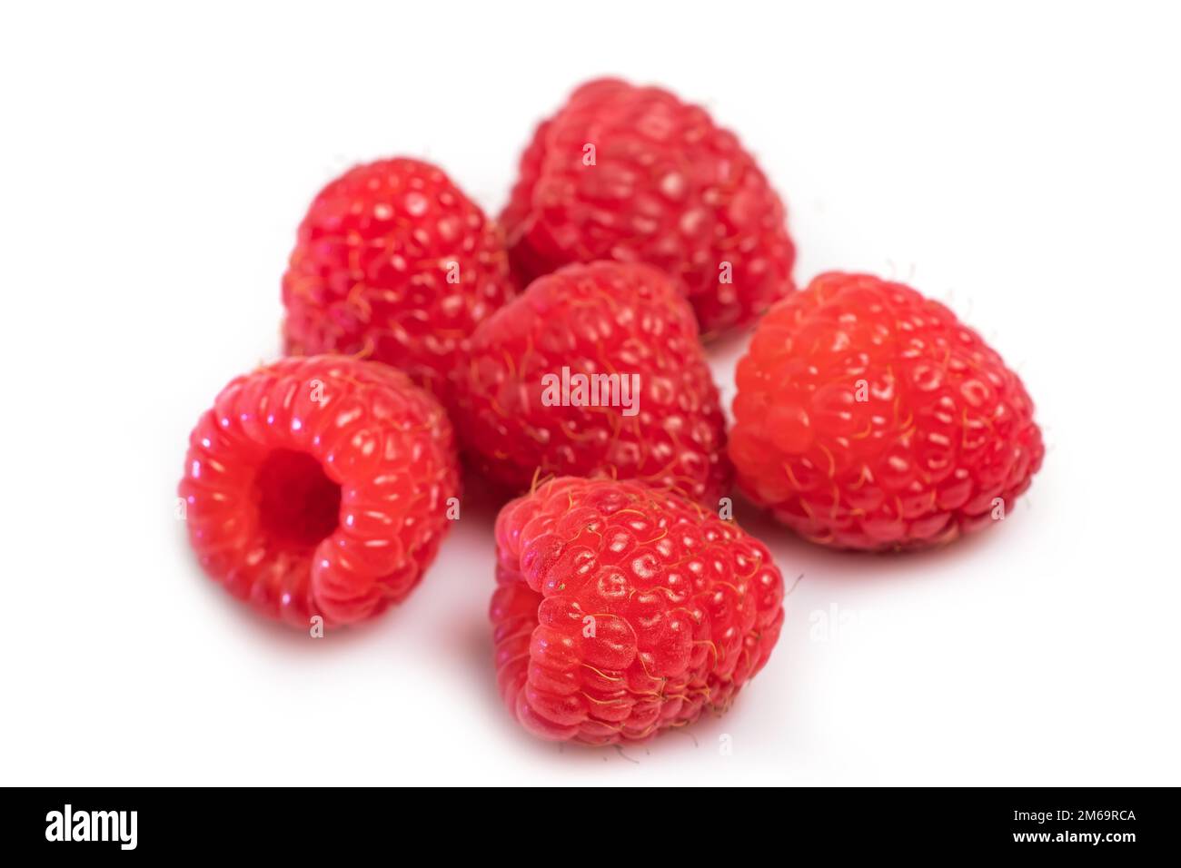 Bunch of raspberry fruits isolated on white background Stock Photo - Alamy
