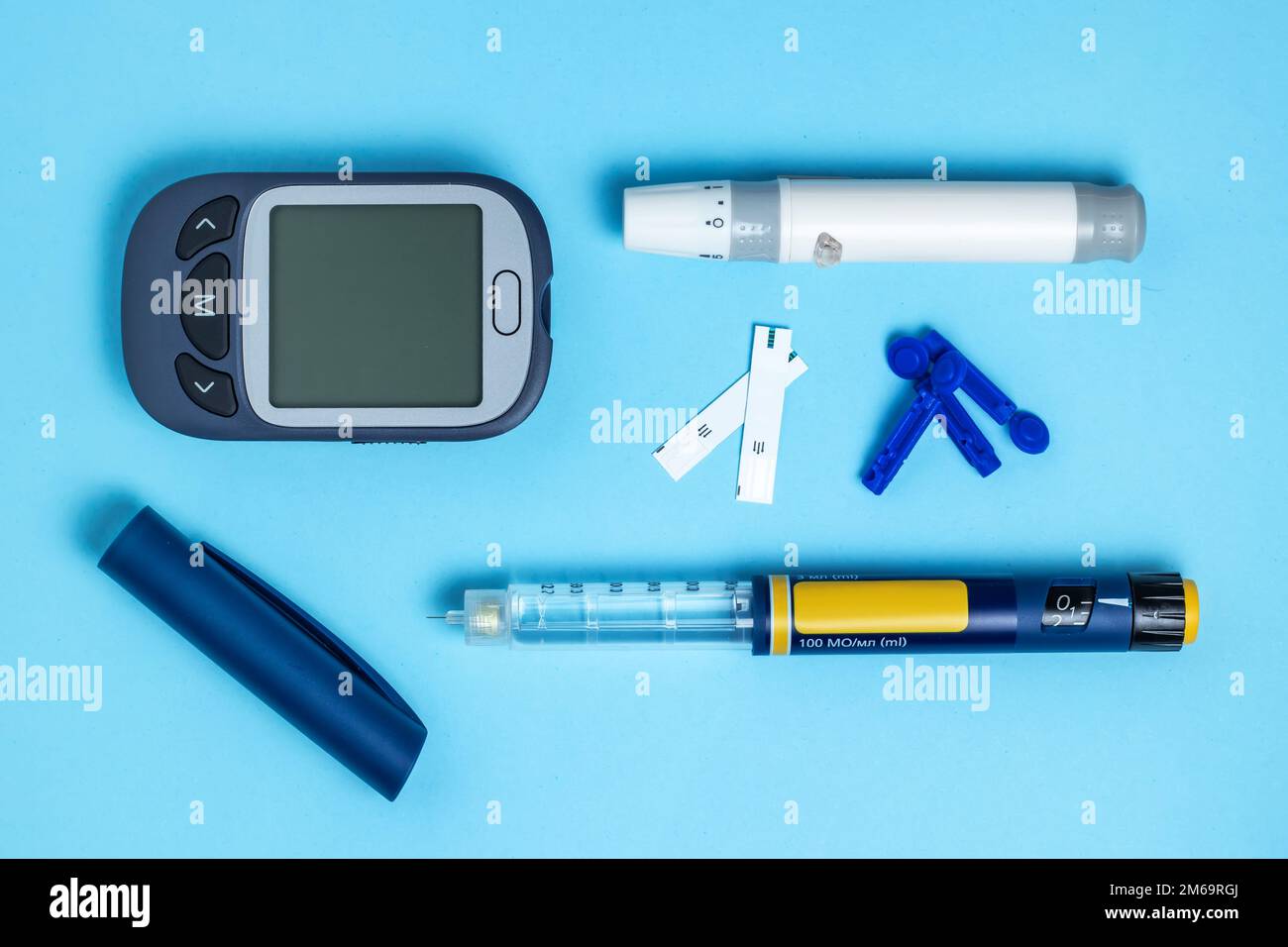 Measuring blood sugar. Glucometer, insulin pen, lancet and test strip ...