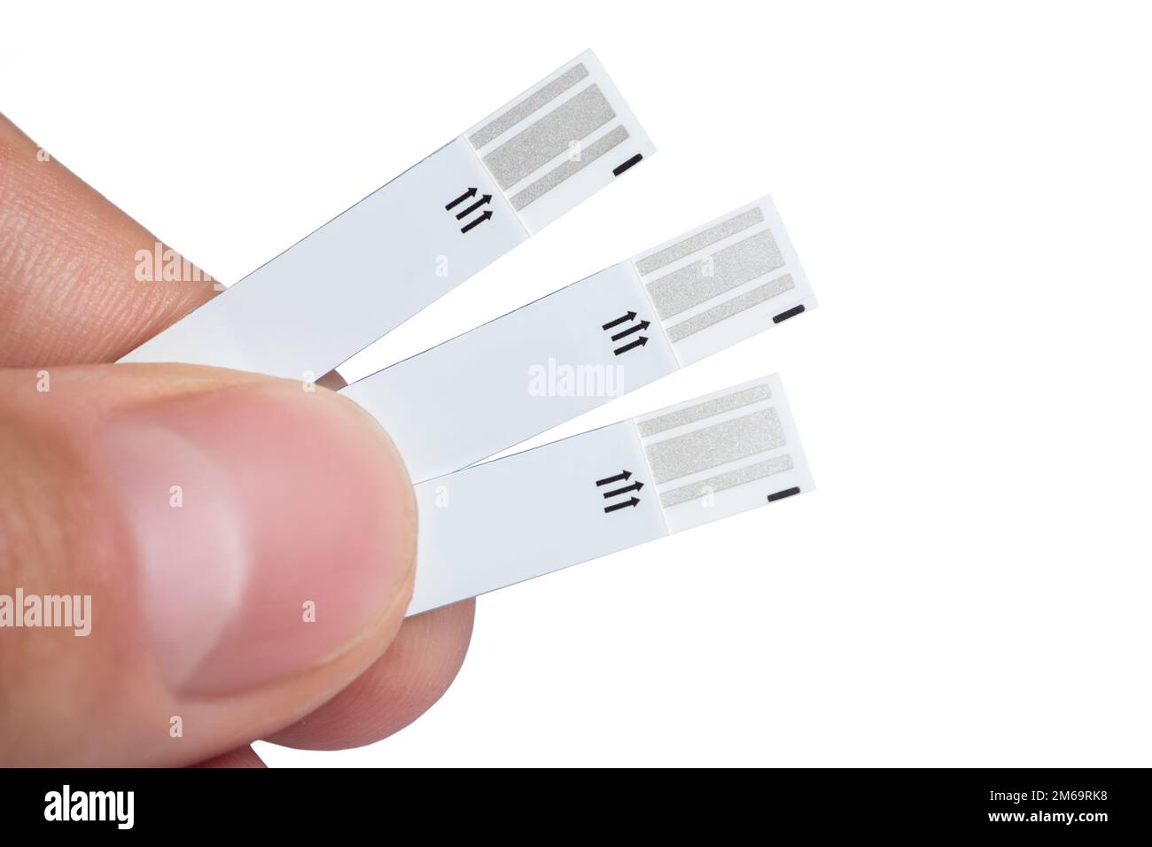 Glucometer test strips in hand on a white background Stock Photo - Alamy
