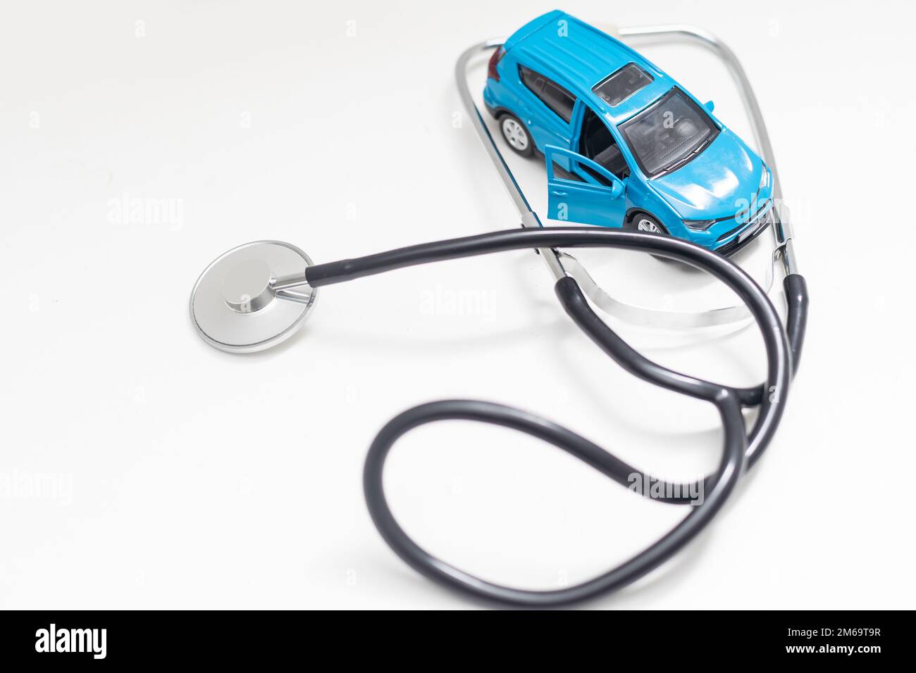 Toy car and stethoscope. Car automotive diagnostic, inspection, repair ...