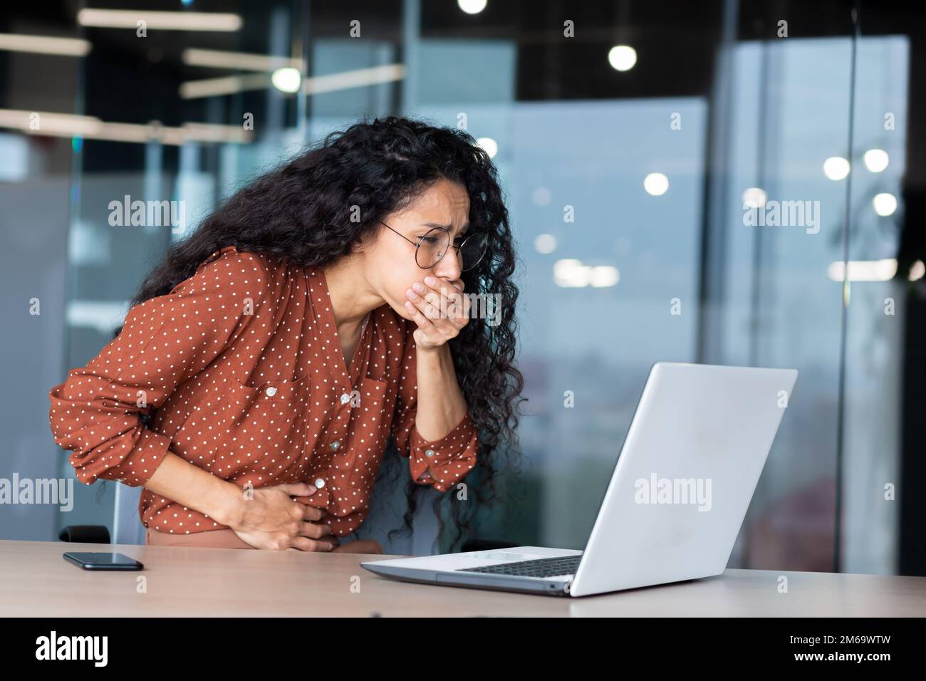 Businesswoman has severe nausea, latin american woman at work sick ...
