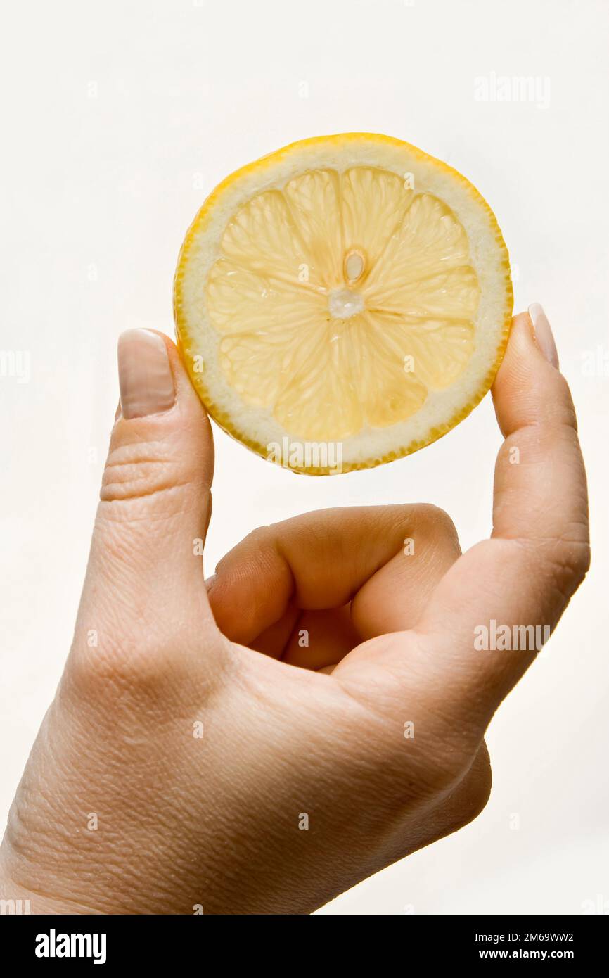 Lemon wedge white background hi-res stock photography and images - Alamy