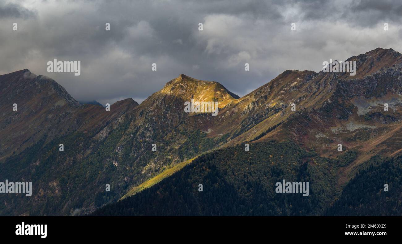 Ridge in morning sunburst. Range Mamkhurts. Northwest spurs Greater ...