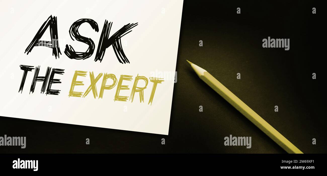 Ask the Expert Text written on notebook page, red pencil on the right. Motivational Concept ...