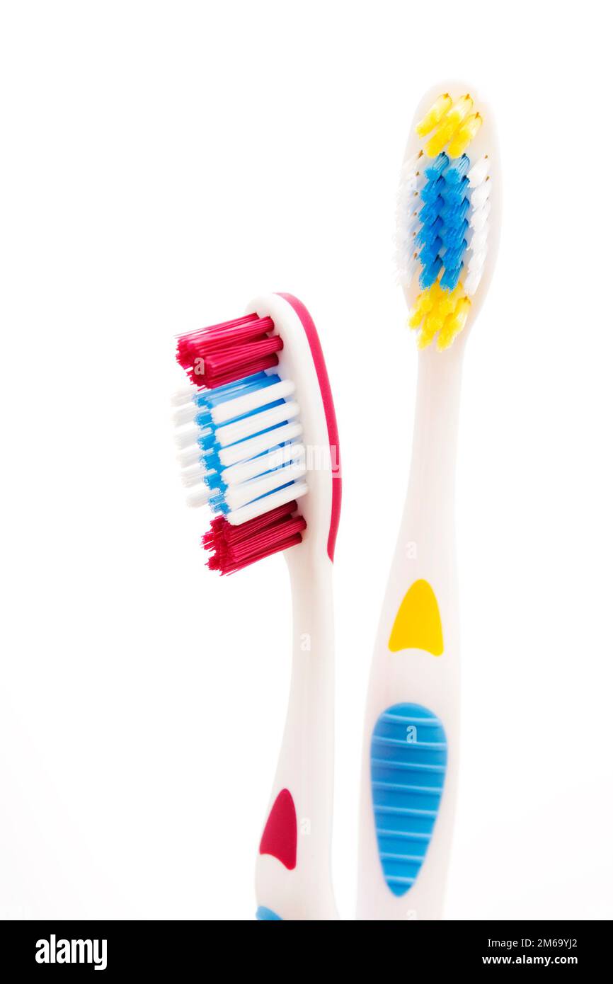 Red and yellow toothbrushes Stock Photo - Alamy