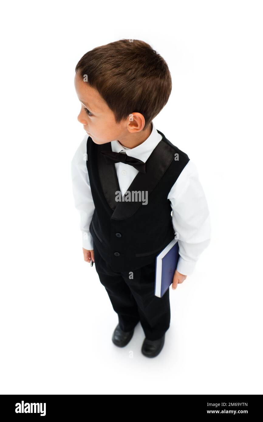 Boy holding pen and book Stock Photo - Alamy