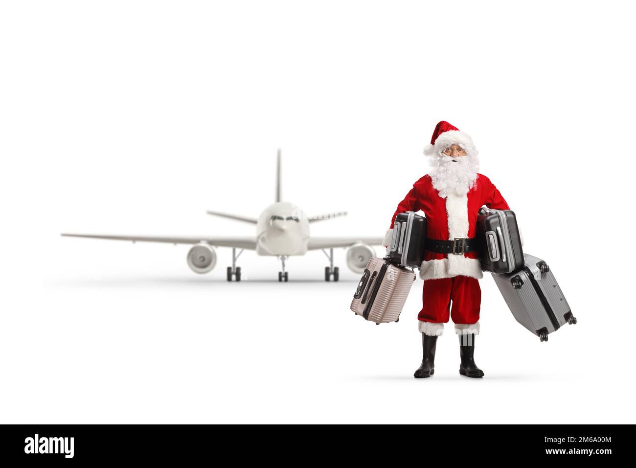 Santa claus carrying suitcases in front of an airplane isolated on ...