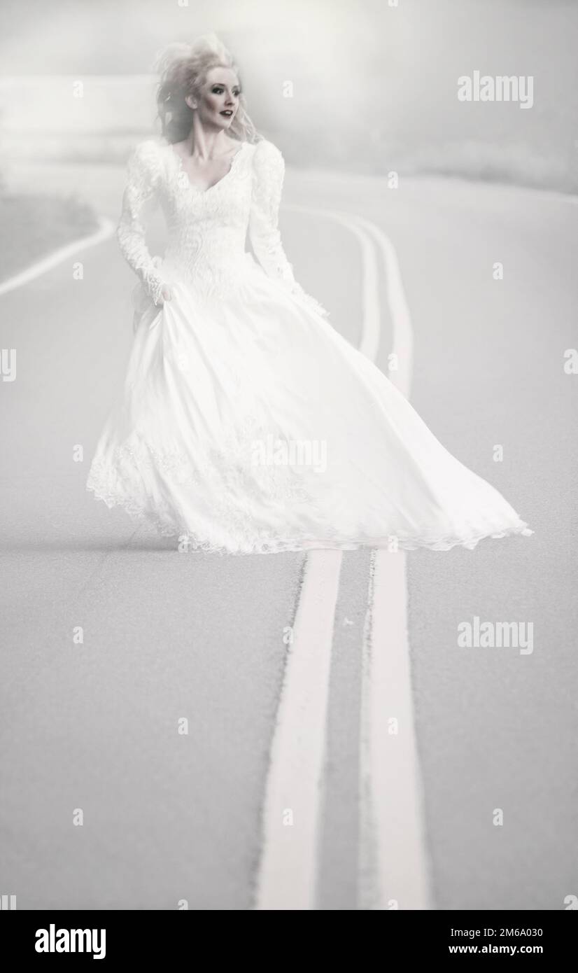 ghost bride runs down highway Stock Photo - Alamy