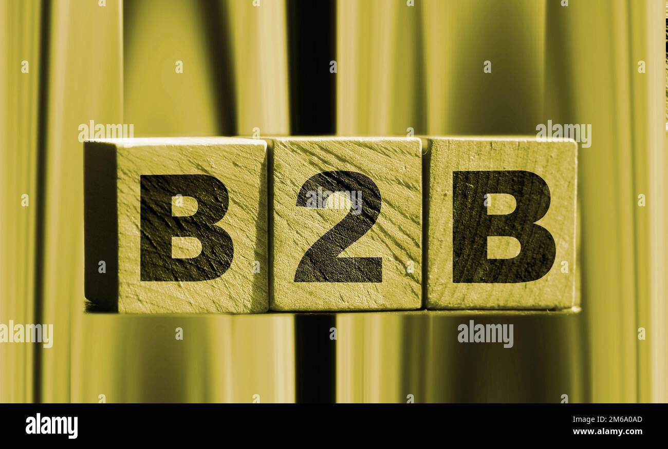 B2C letters on wooden cubes put on wooden table standing outdoors ...