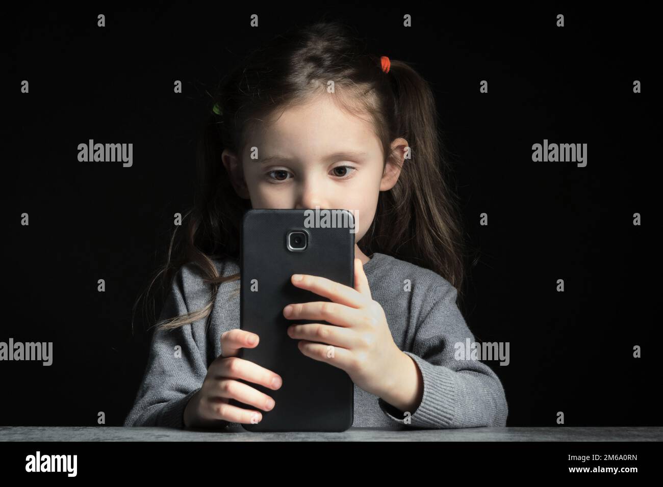 Problem of kids addiction to gadgets, online and screen time. Little ...
