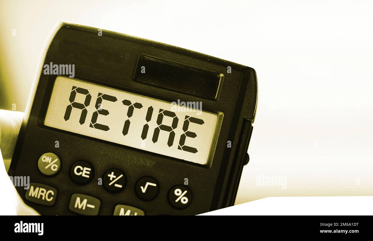 Retire word on calculator display. Retirement career business concept ...