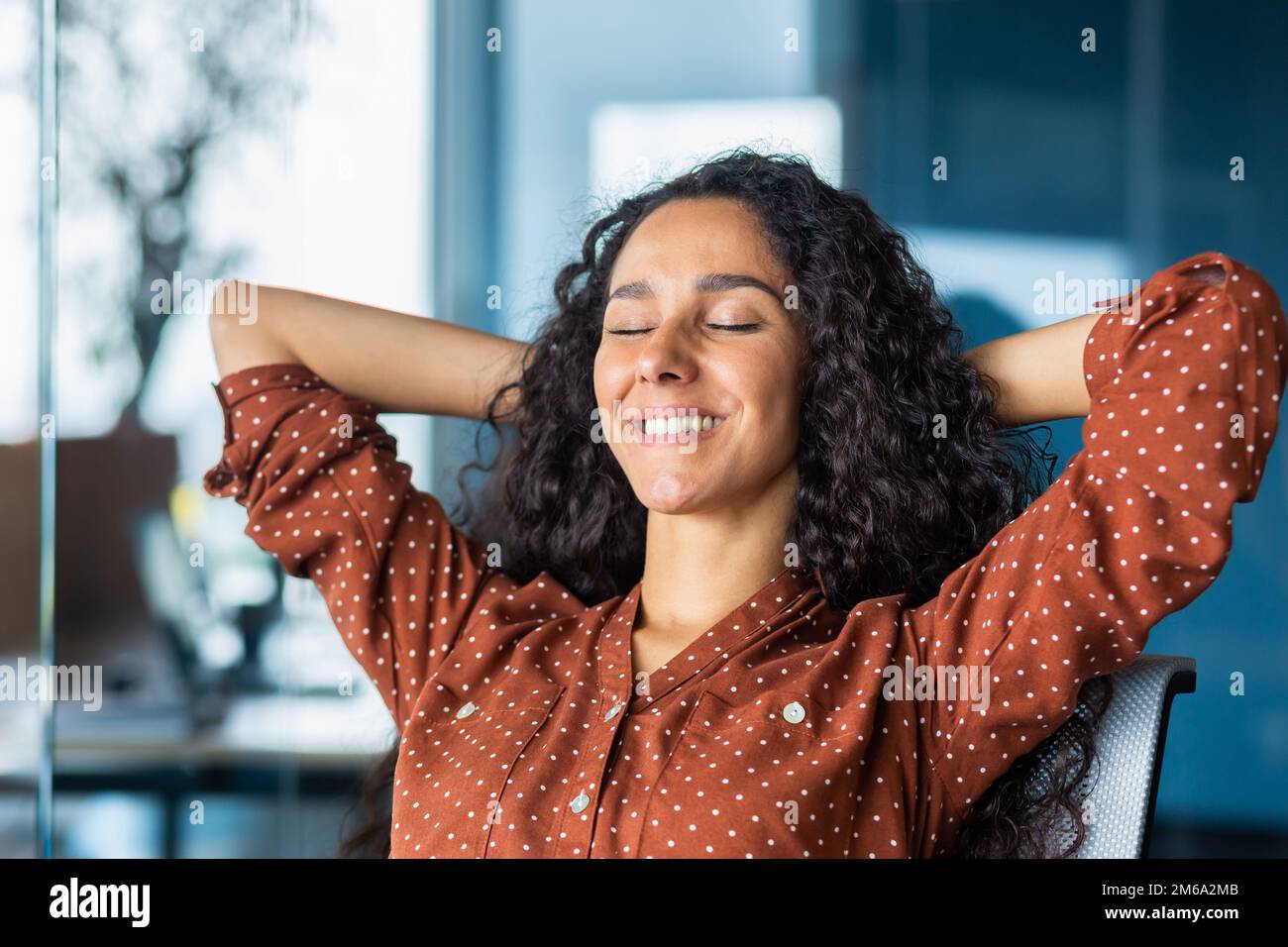 Happy and smiling successful hispanic business woman finished work ...