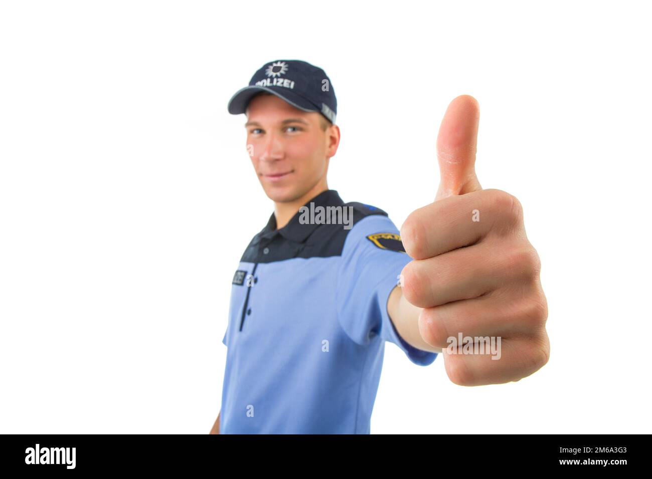 Police in uniform shows thumbs up Stock Photo - Alamy
