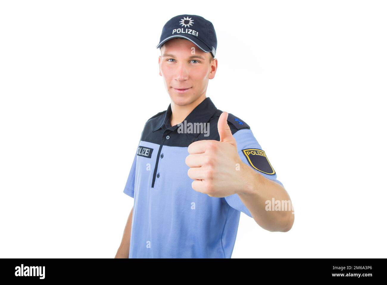 Police in uniform shows thumbs up Stock Photo - Alamy
