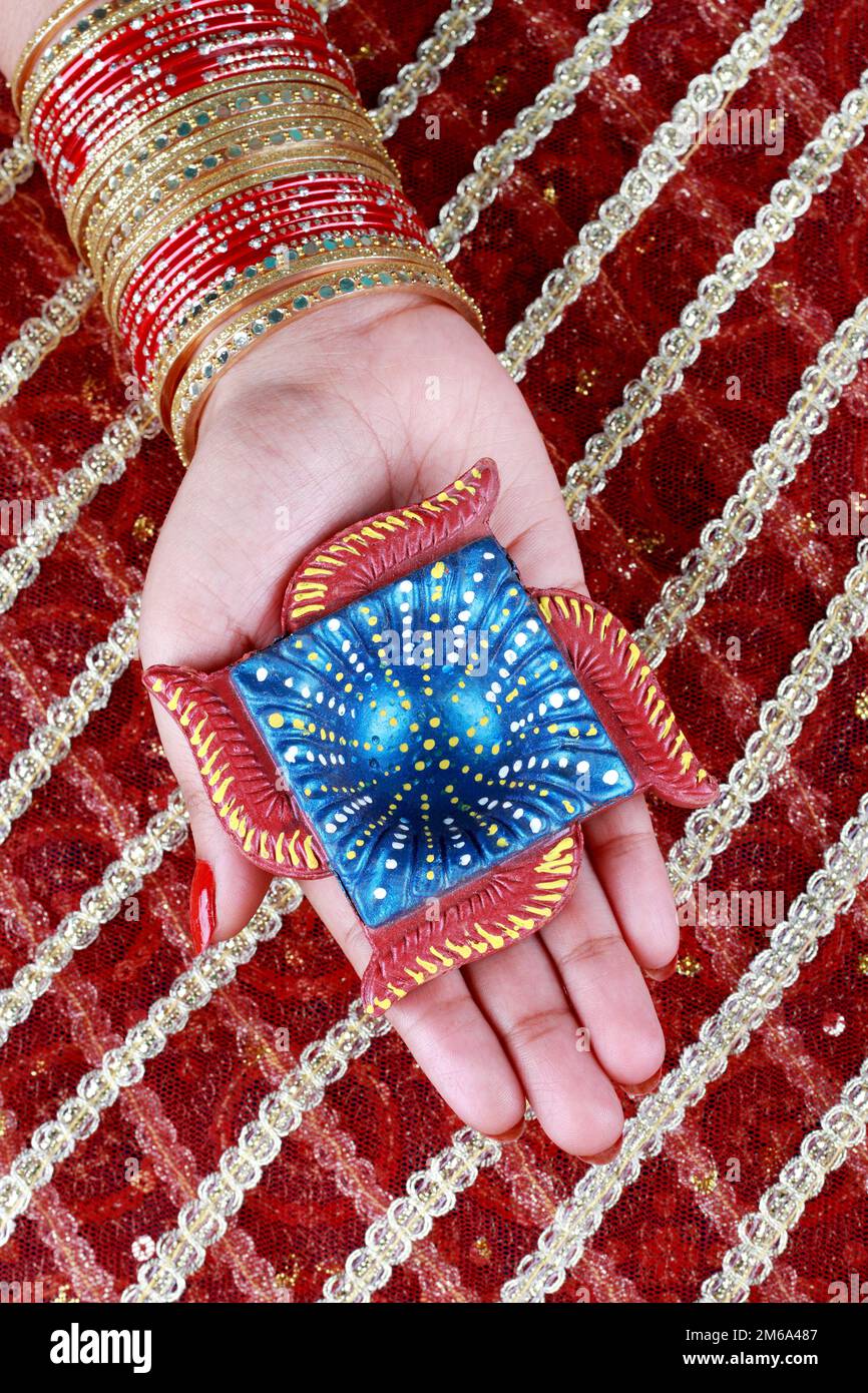 Handmade Diwali Diya Lamp in Hand Stock Photo - Alamy