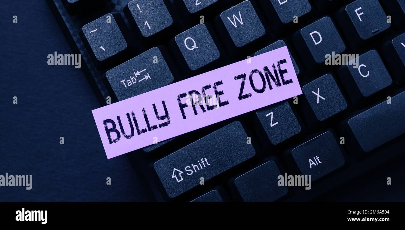 Hand writing sign Bully Free Zone. Word Written on Be respectful to ...